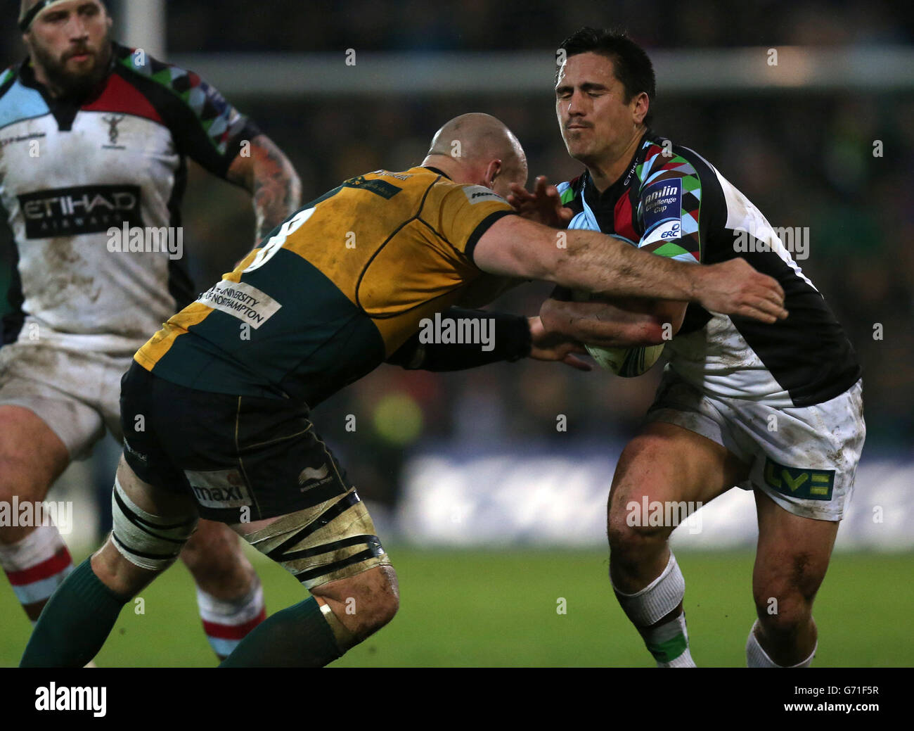 Northampton Saints' Sam Dickinson tackles Harlequins' Ben Botica during ...