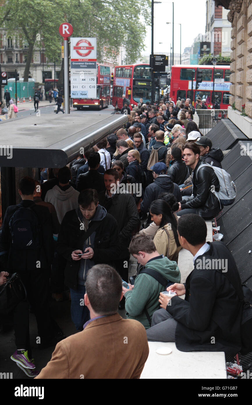 Crowds wait for buses outside Victoria station on the first day of a 48 ...