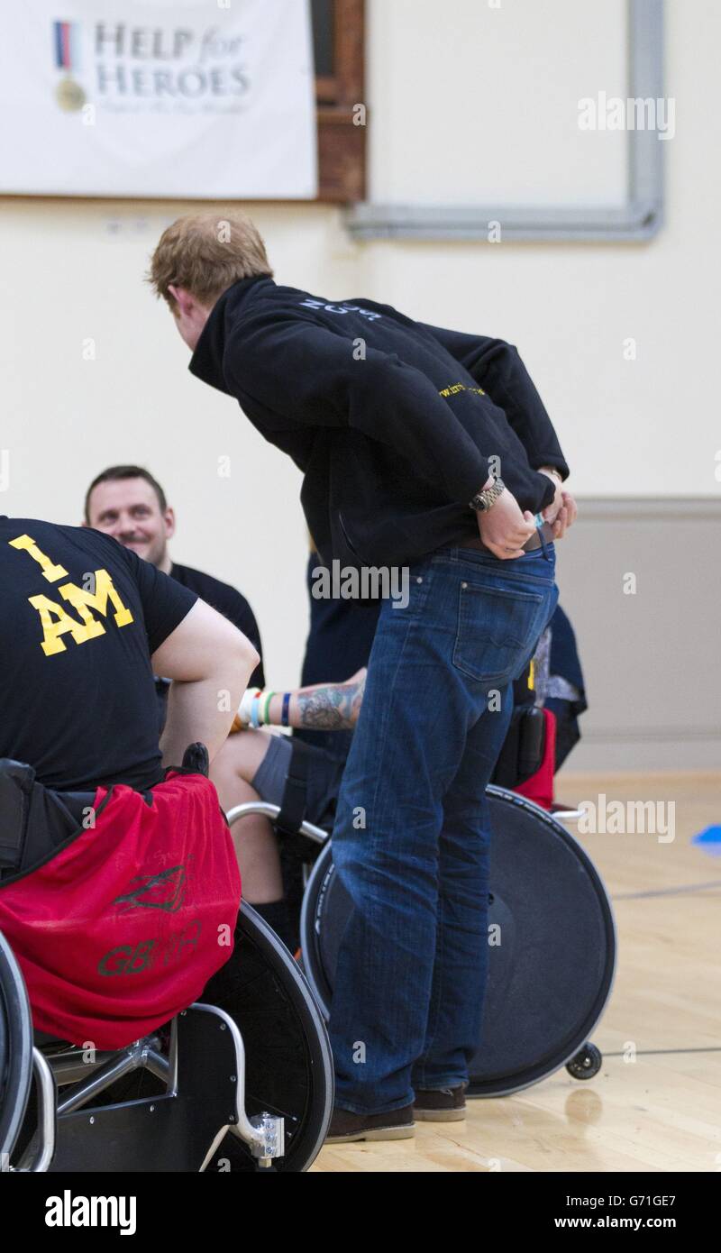 Prince Harry pulls up his jeans after showing off his Hugo Boss ...