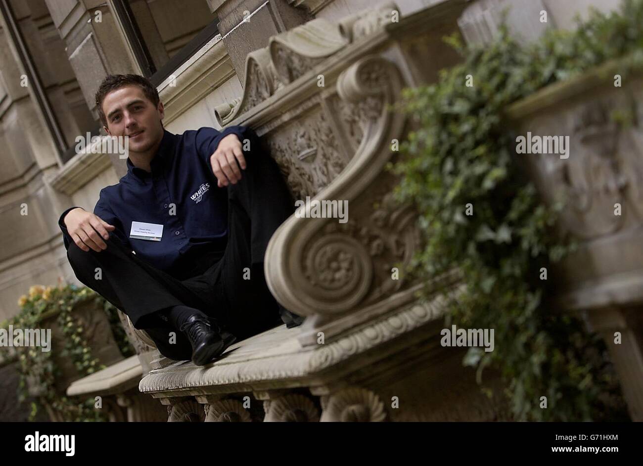 Stuart White, 20 from Prestayten, Wales, relaxes at Drapers Hall, ahead ...