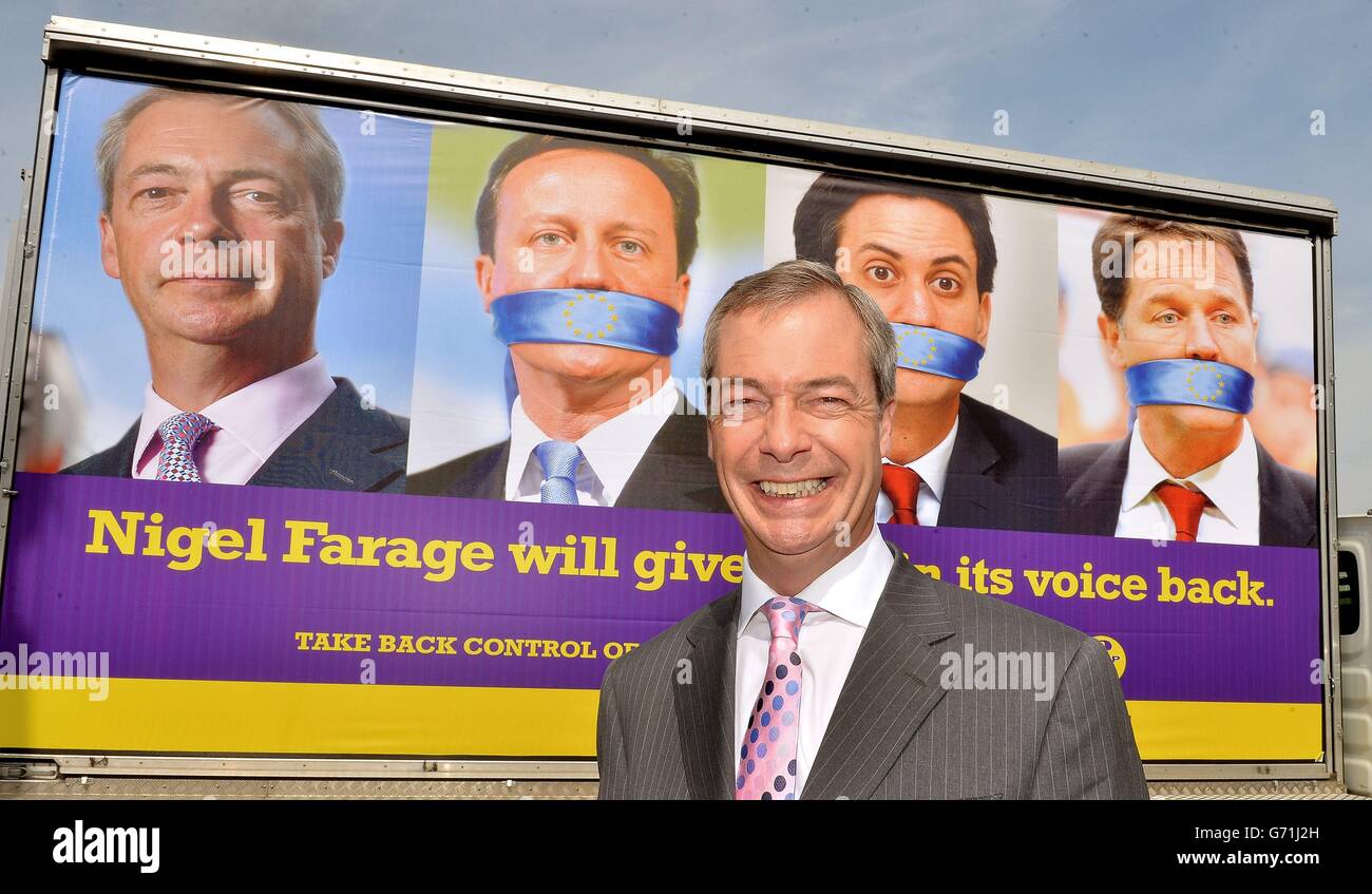 Ukip leader Nigel Farage smiles after unveiling a new billboard poster ...