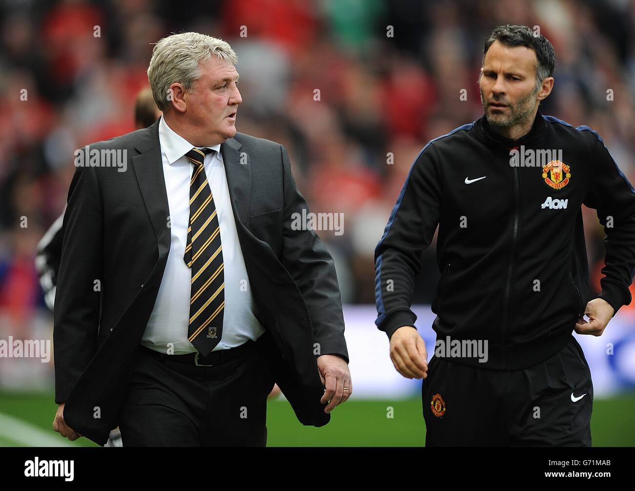 Manchester United's interim manager Ryan Giggs (right) walks down the ...