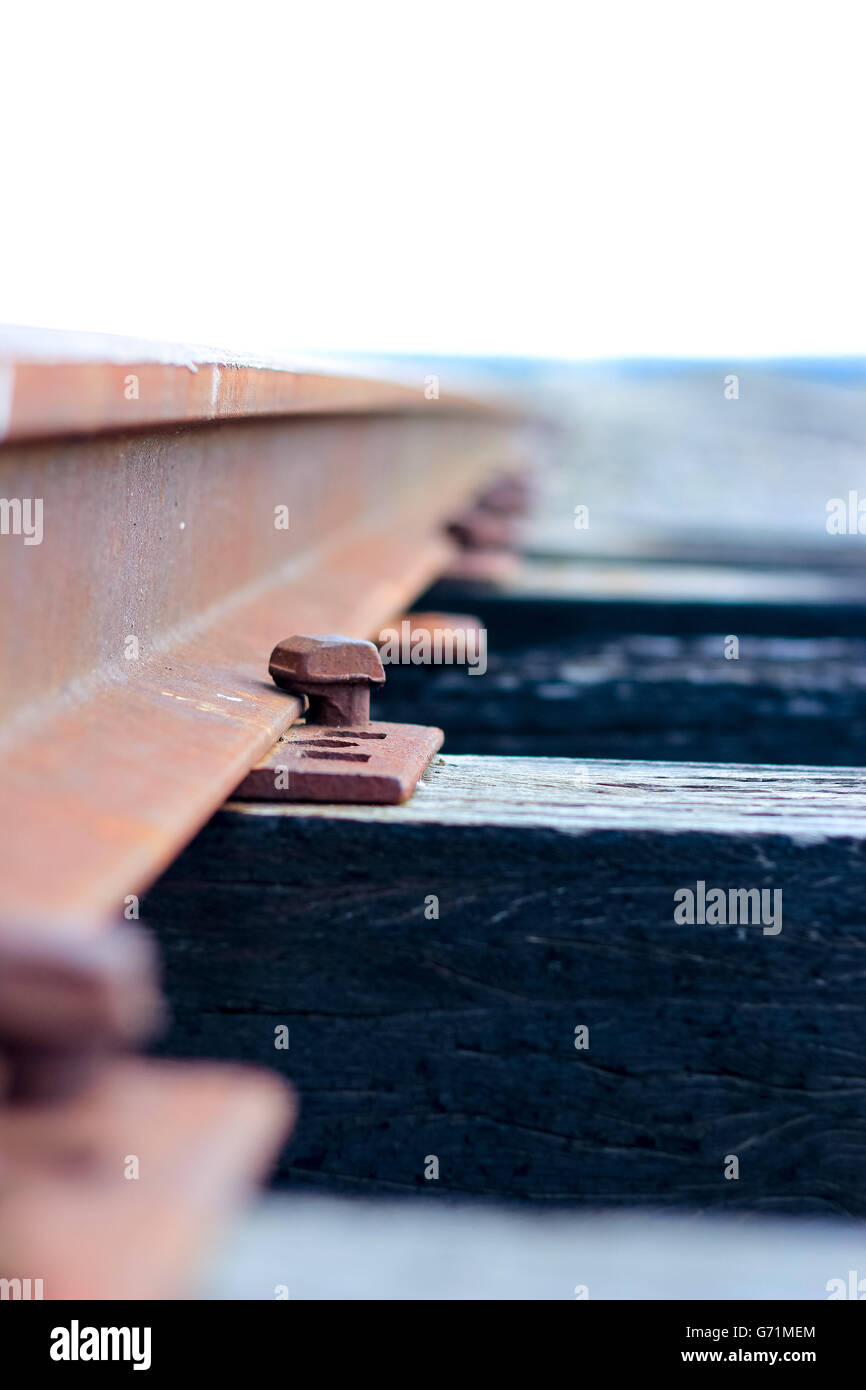Close up of rusty railway lines crossing an old wooden bridge Stock ...