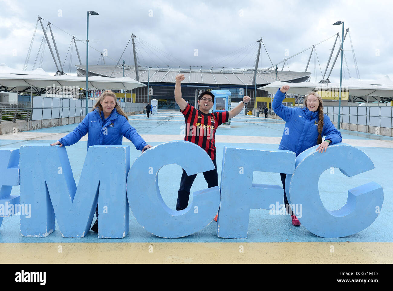 Manchester City fan Nadmin Roshdi poses with an MCFC sign before the ...