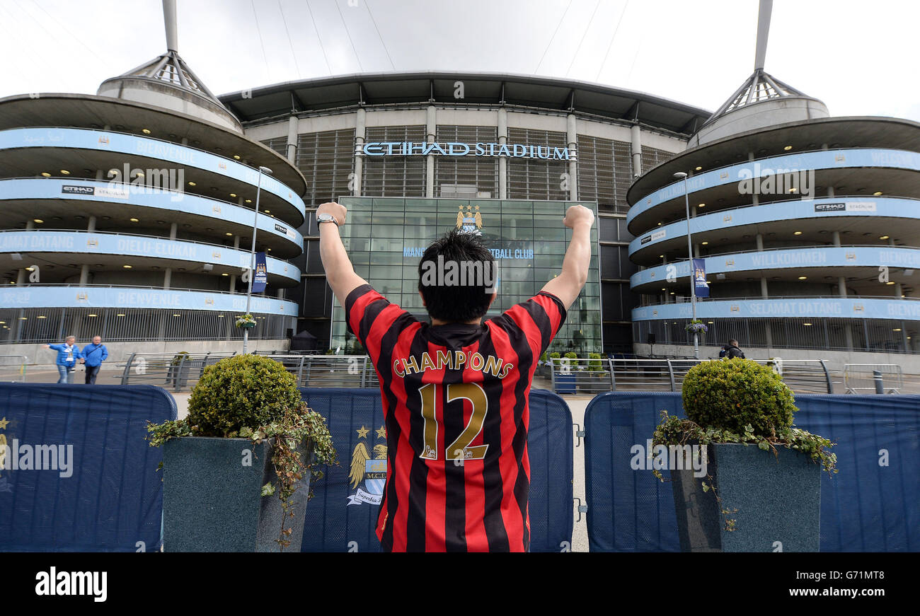 Manchester City fan Nadmin Roshdi poses with an MCFC sign before the ...