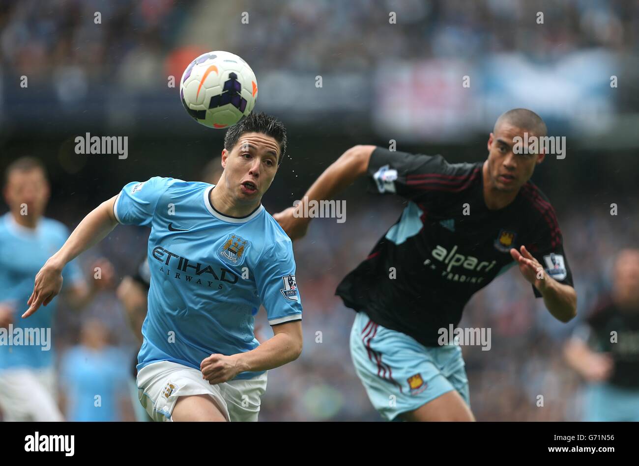 Manchester City's Samir Nasri (left) and West Ham United's Winston Reid ...
