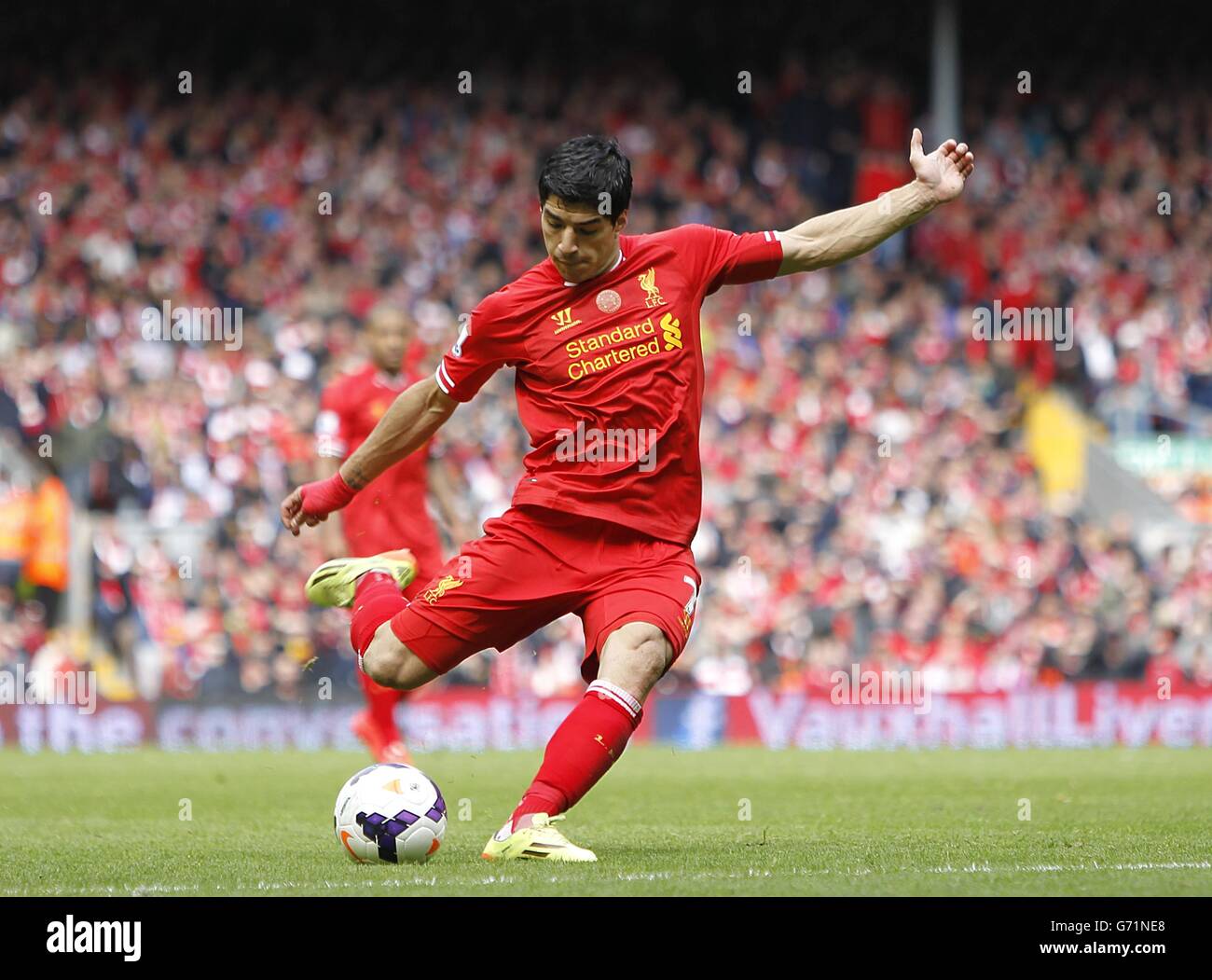 Liverpools luis suarez takes a free kick hi-res stock photography and ...