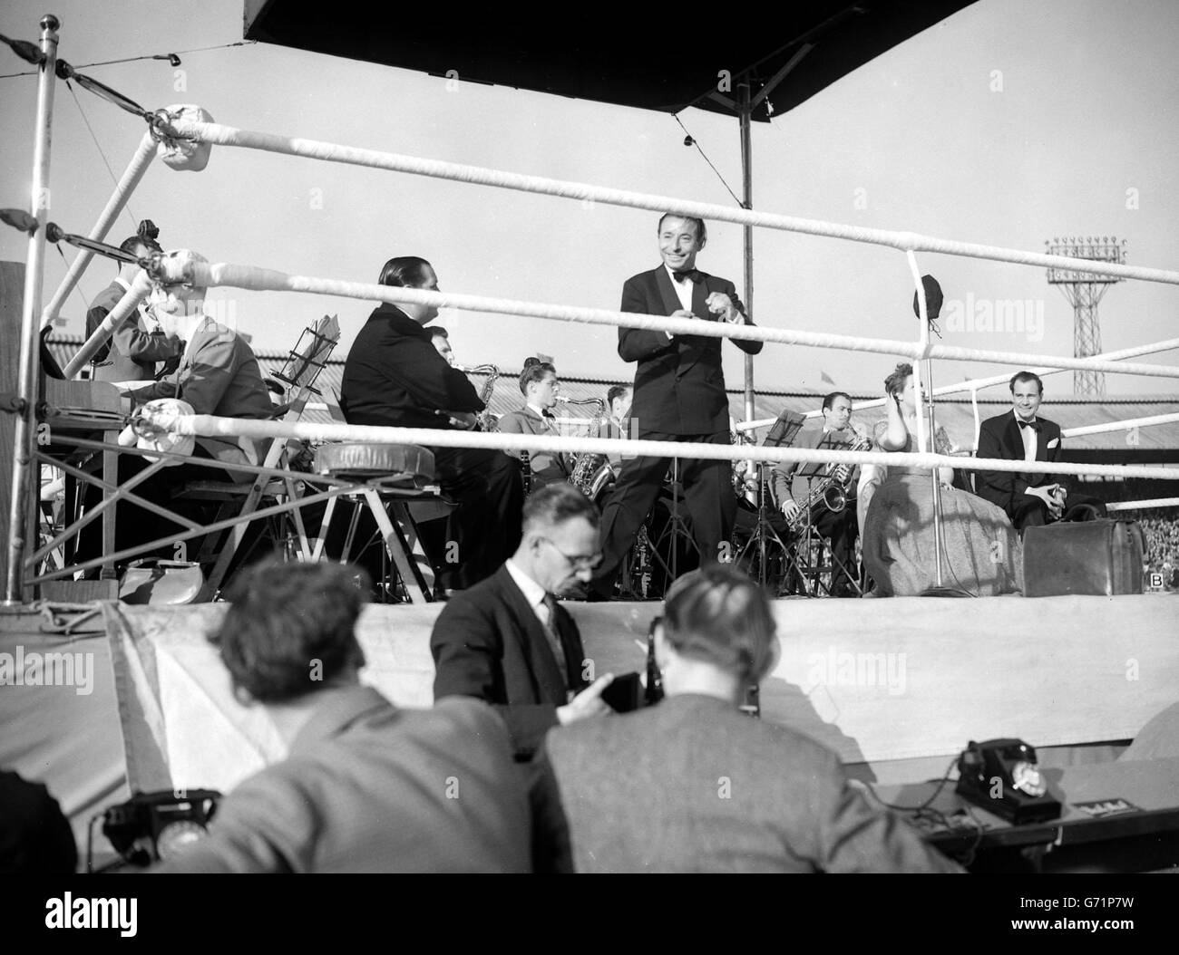 Joe Loss conducting his orchestra in the ring at the White City Stadium ...