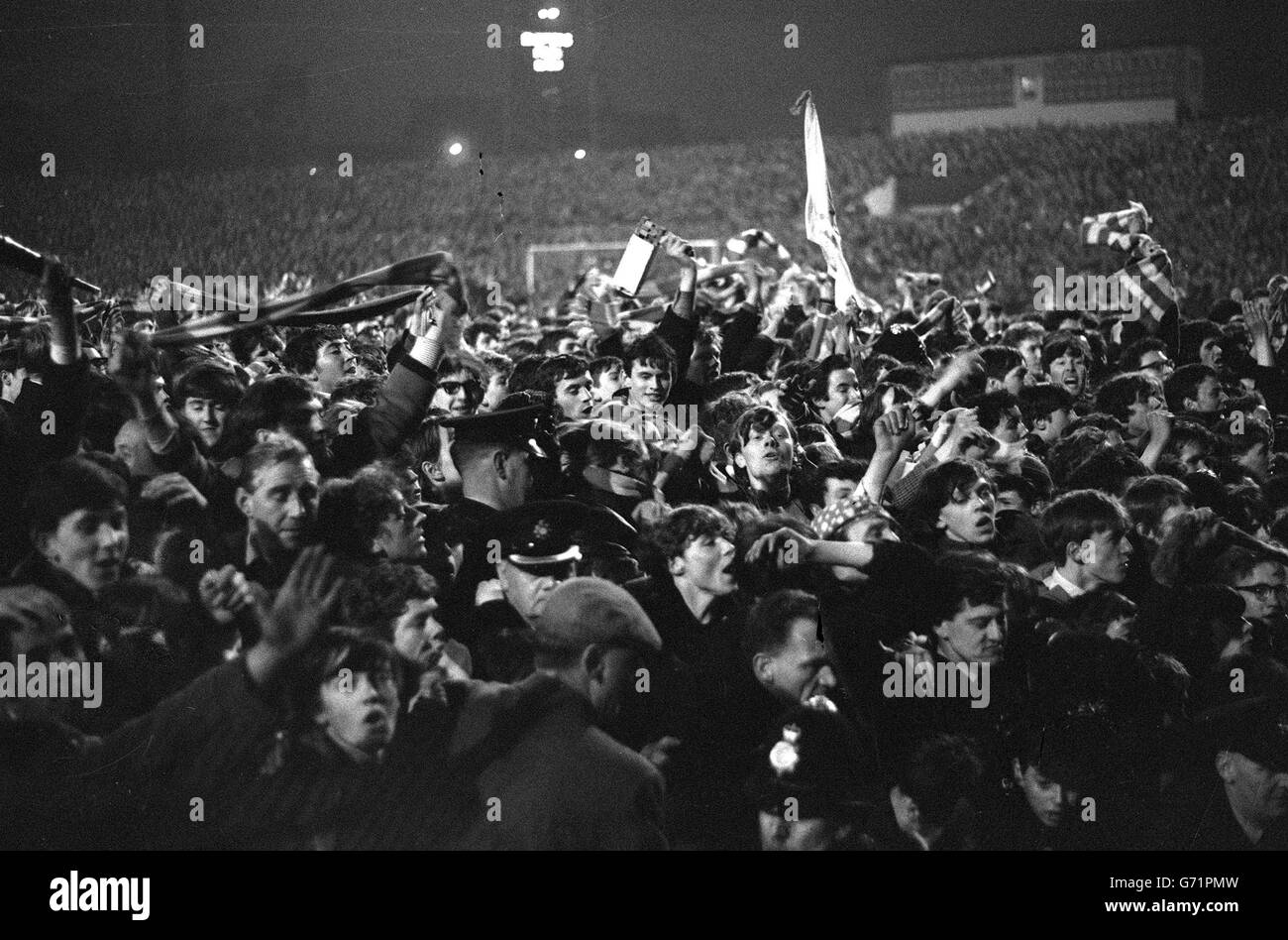 The crowd surge onto the pitch after Manchester United clinched the ...