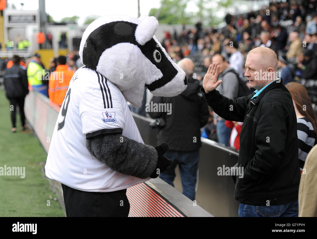 Fulham mascot Billy the Badger greets fans before the game Stock Photo ...