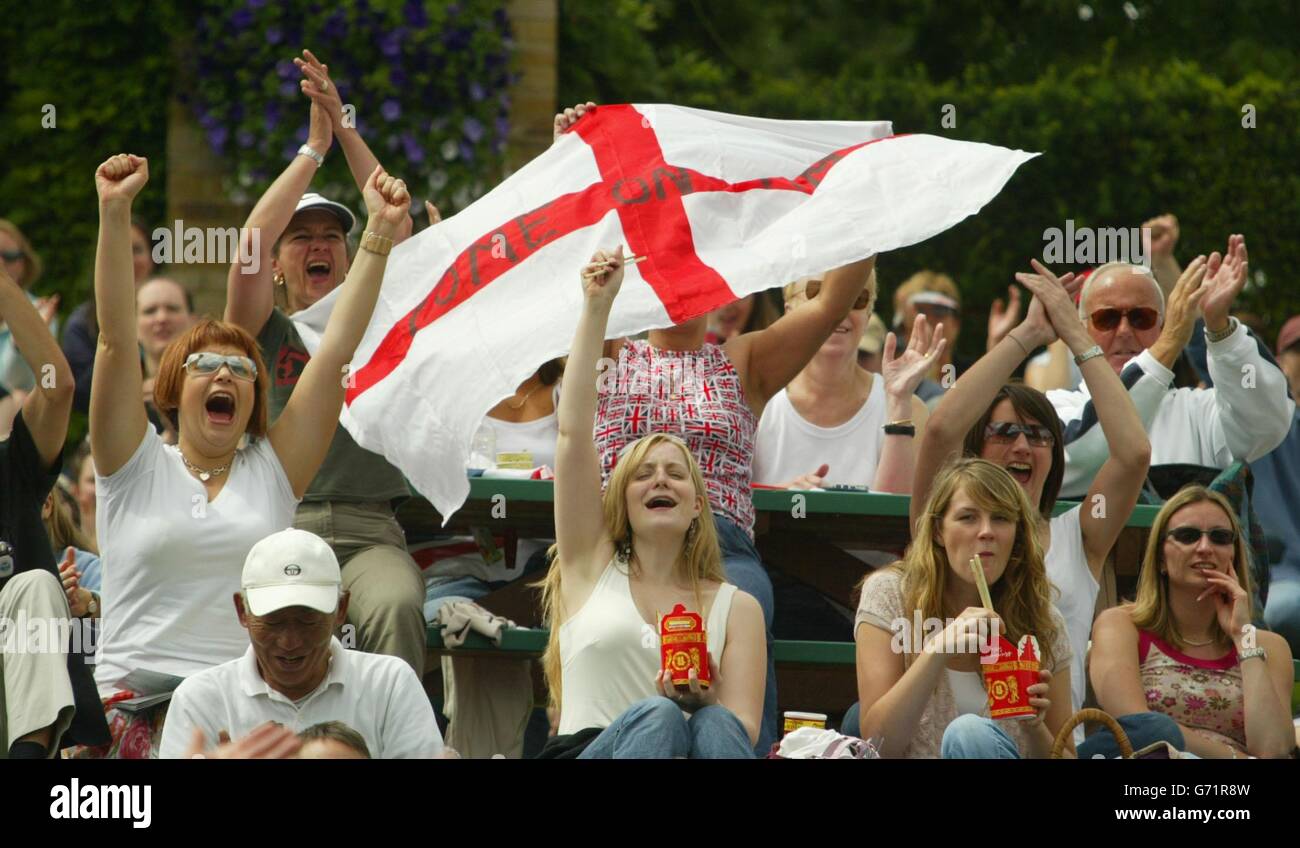 Tennis fans cheer on their hero Tim Henman from Henman Hill at The Lawn ...