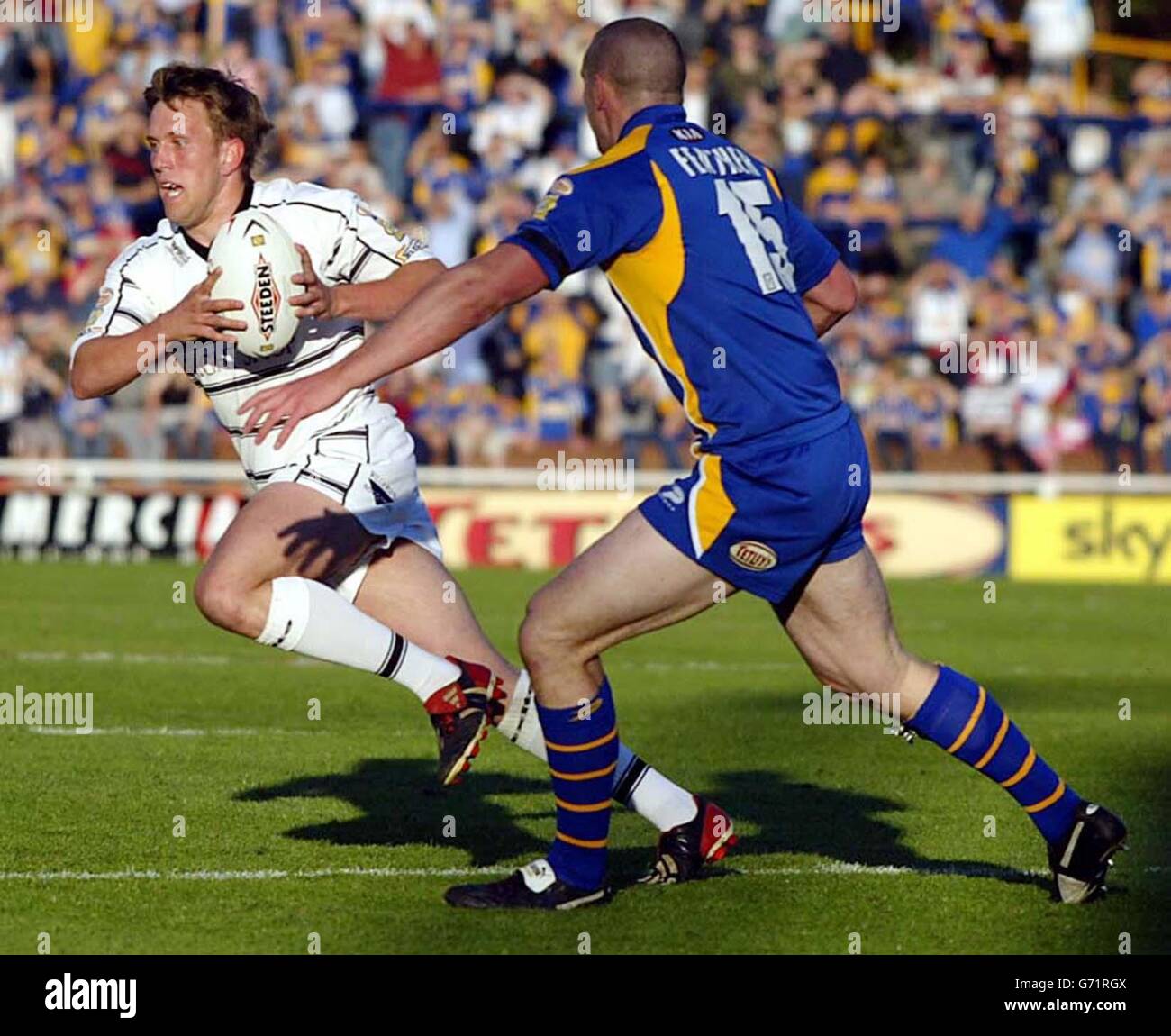 : Hull's Peter Lupton strides past Leed's Chris Feather during their ...