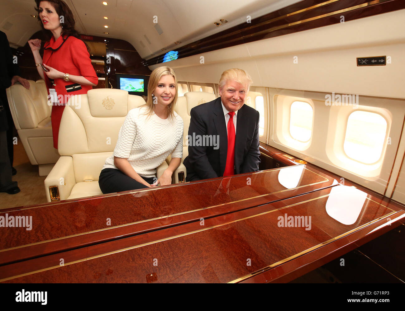 American tycoon Donald Trump with daughter Ivanka onboard his private jet as they arrive at ...