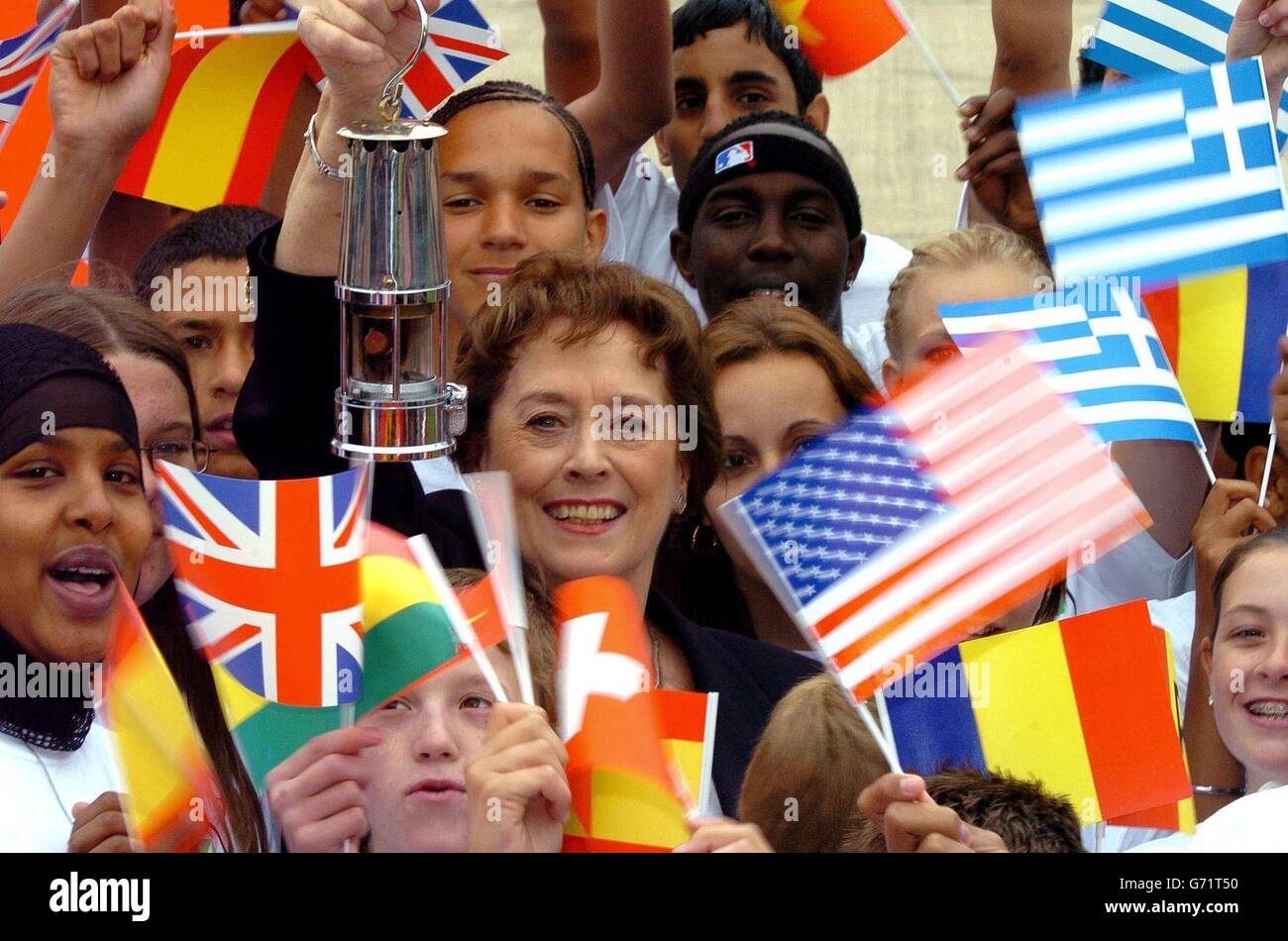 Sylvia Disley a British Olympian from the 1948 Games holds aloft the ...