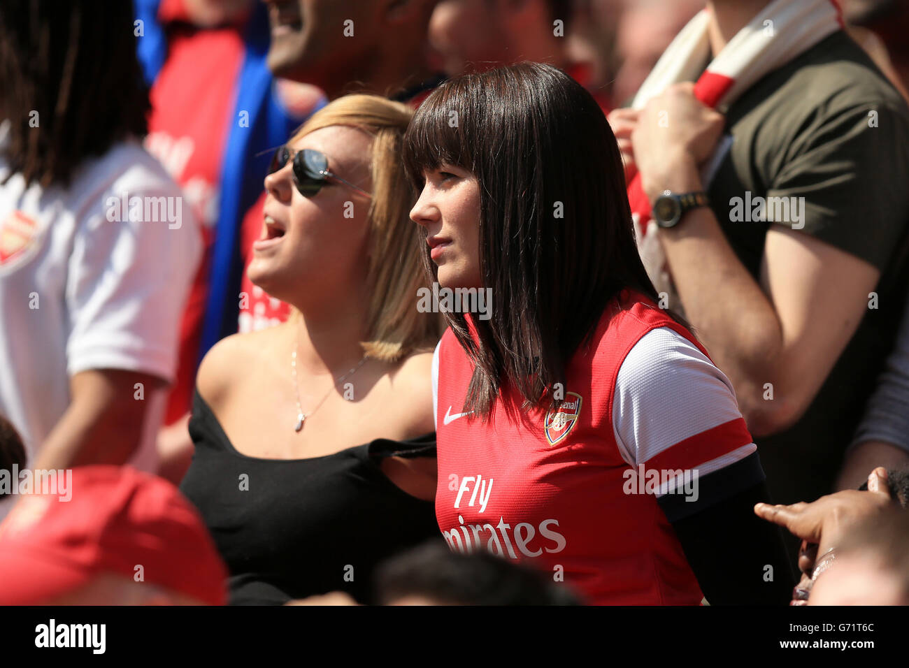 Female arsenal fans watch the game in the stands hi-res stock ...