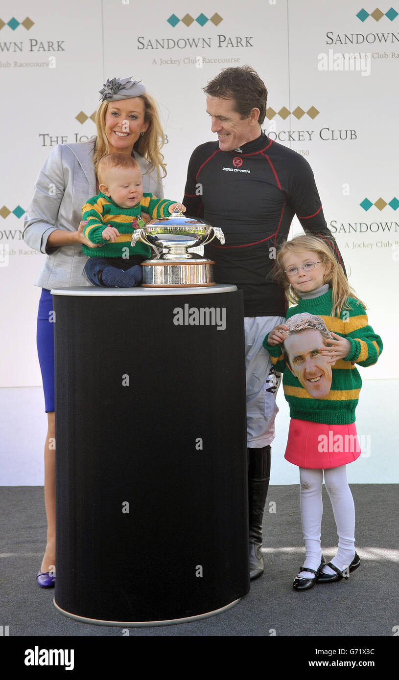 AP McCoy, his son Archie, wife Chanelle and daughter Eve at the podium ...