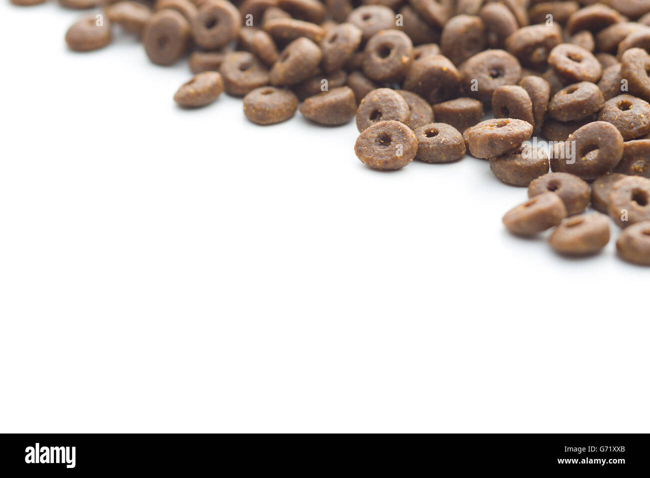 Dry kibble dog food isolated on white background Stock Photo - Alamy