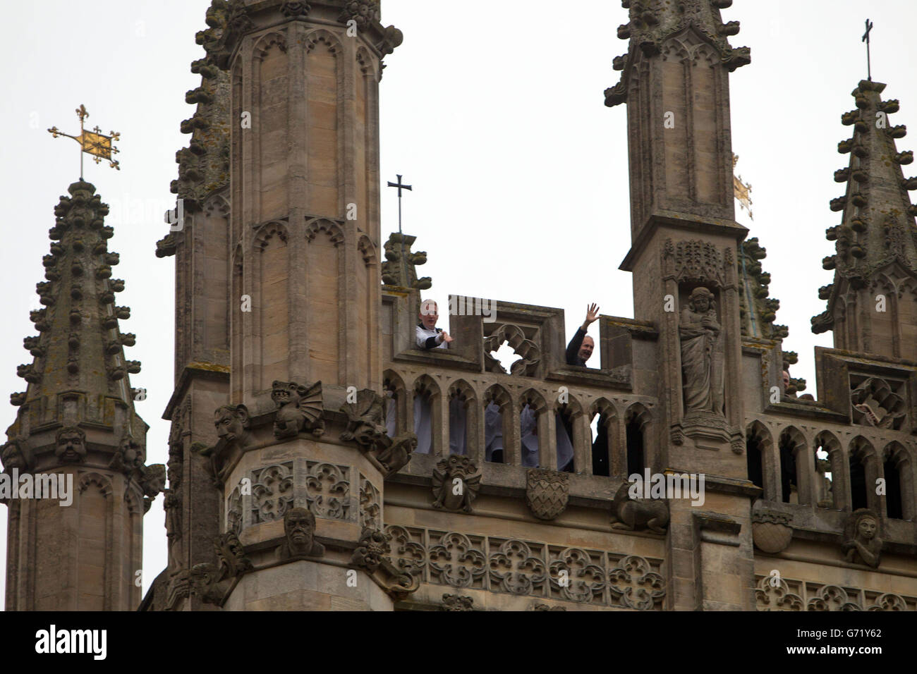 The choir wave after performing to the people gathered below celebrate ...