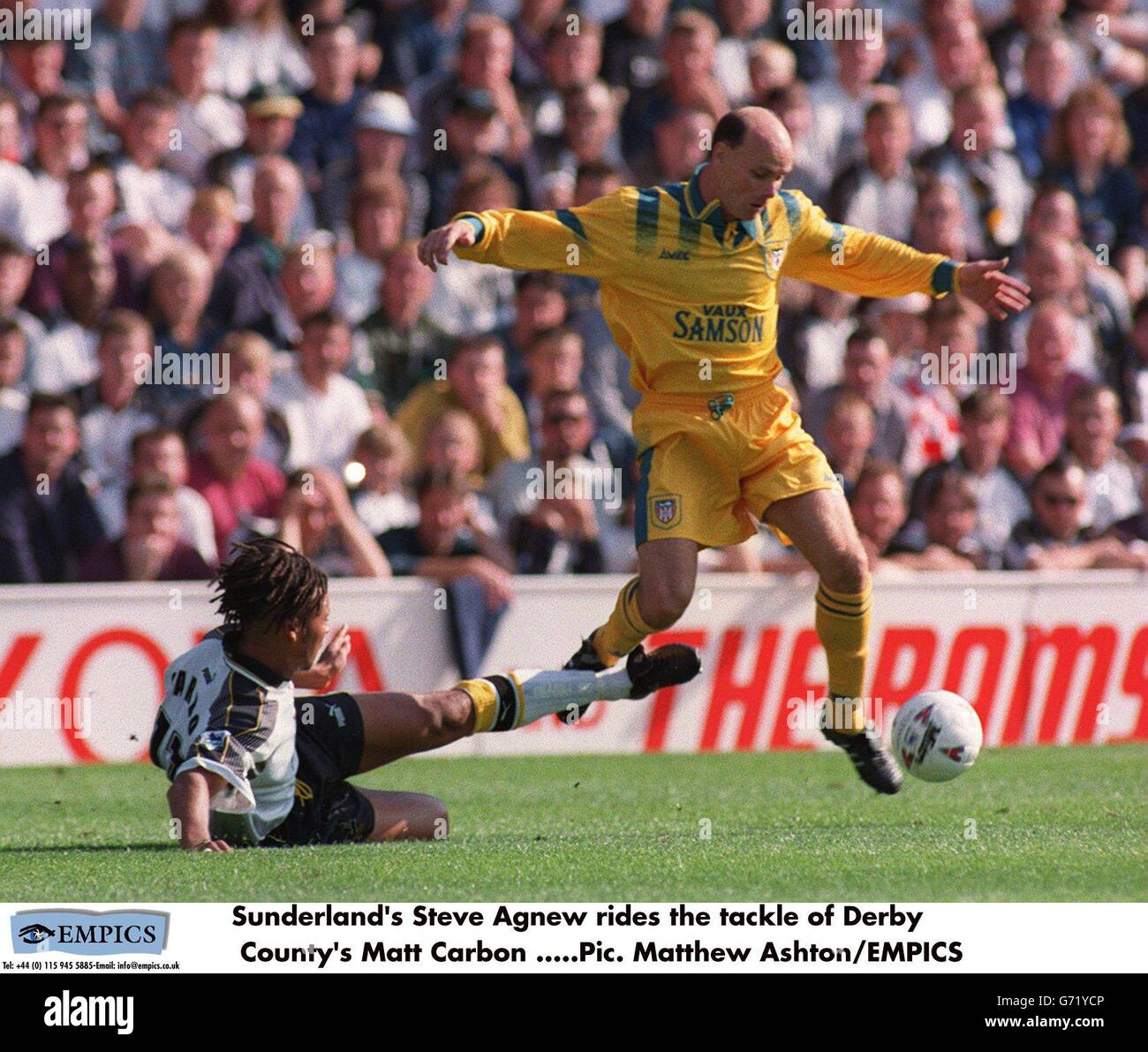 Sunderland's Steve Agnew rides the tackle of Derby County's Matt Carbon ...