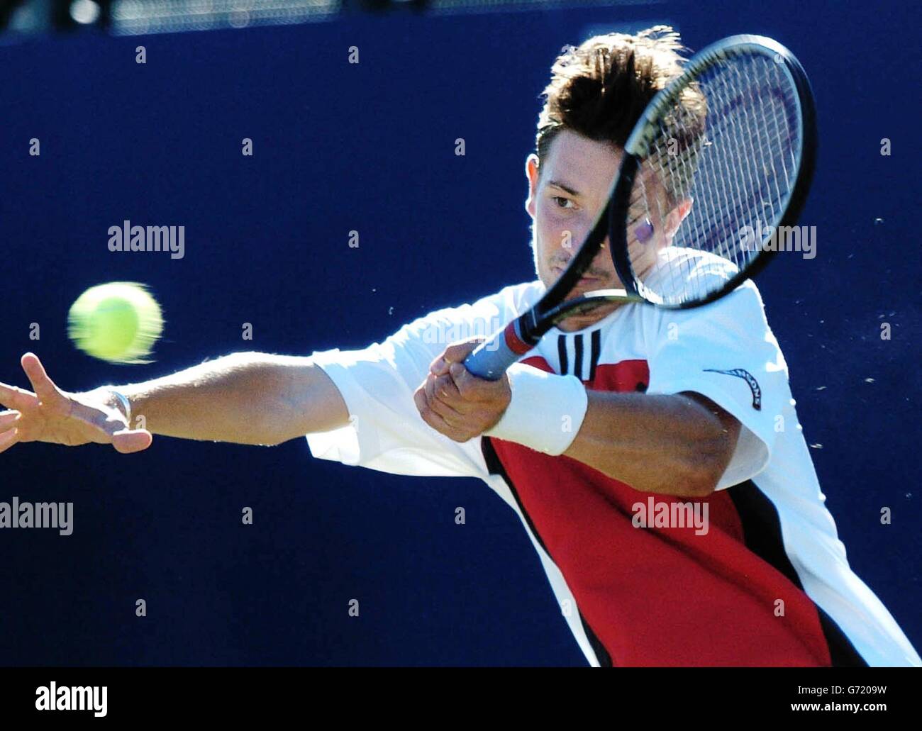 Alex Bogdanovic of Great Britain on his way to victory over Joachim ...