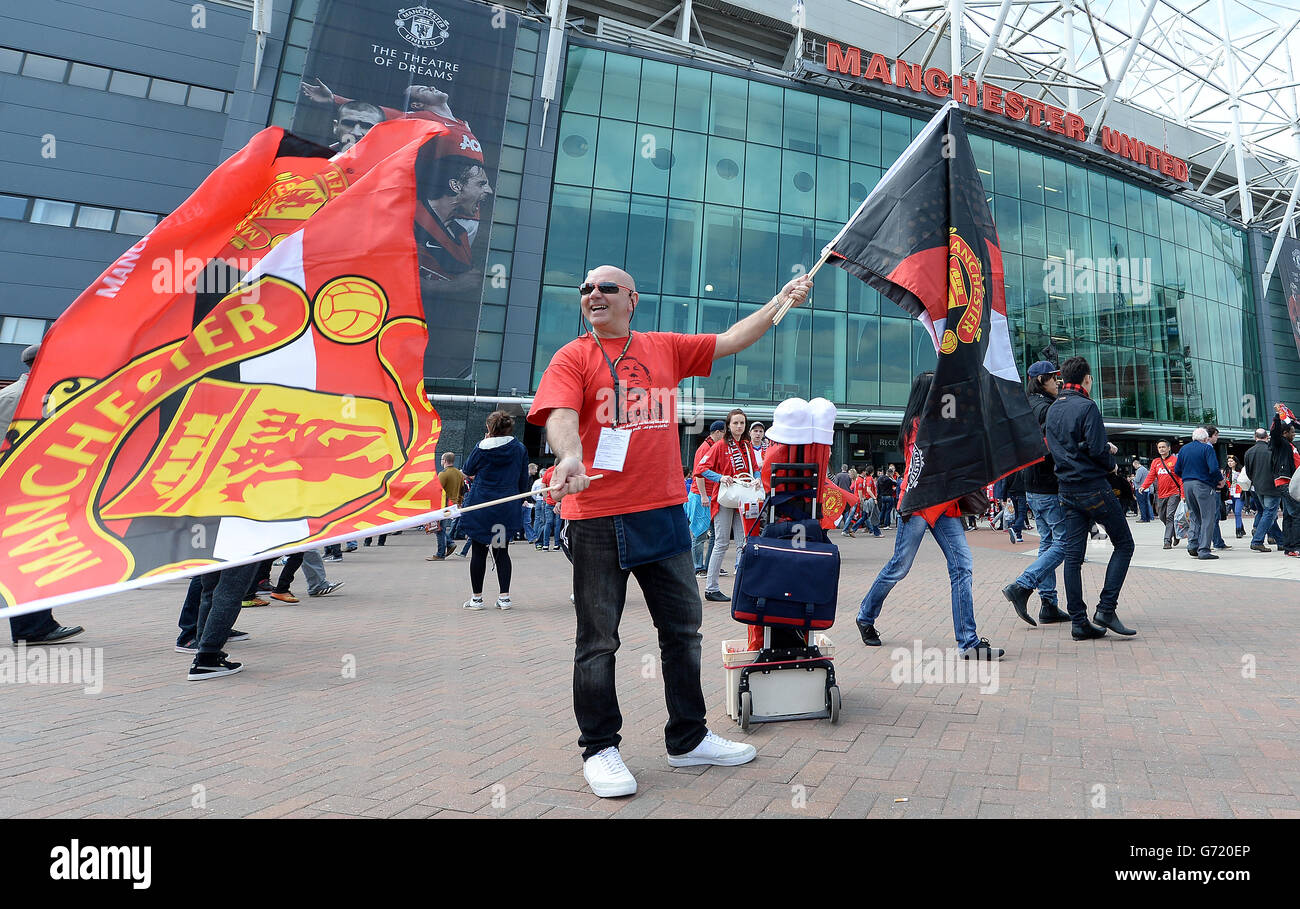 Fans purchase flags before the Barclays Premier League match at Old ...