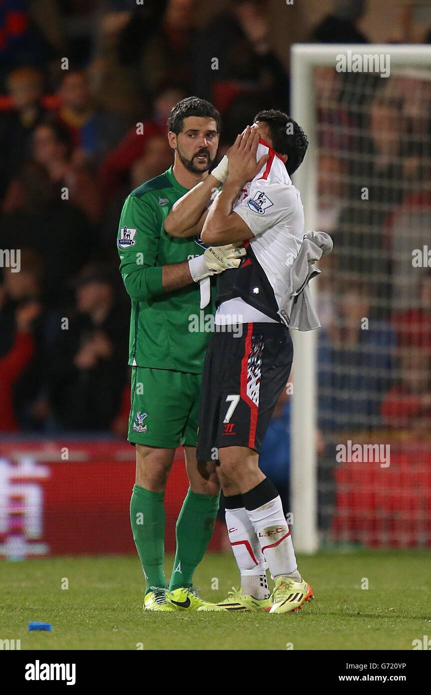 Liverpool's Luis Suarez is consoled by Crystal Palace goalkeeper Julian ...