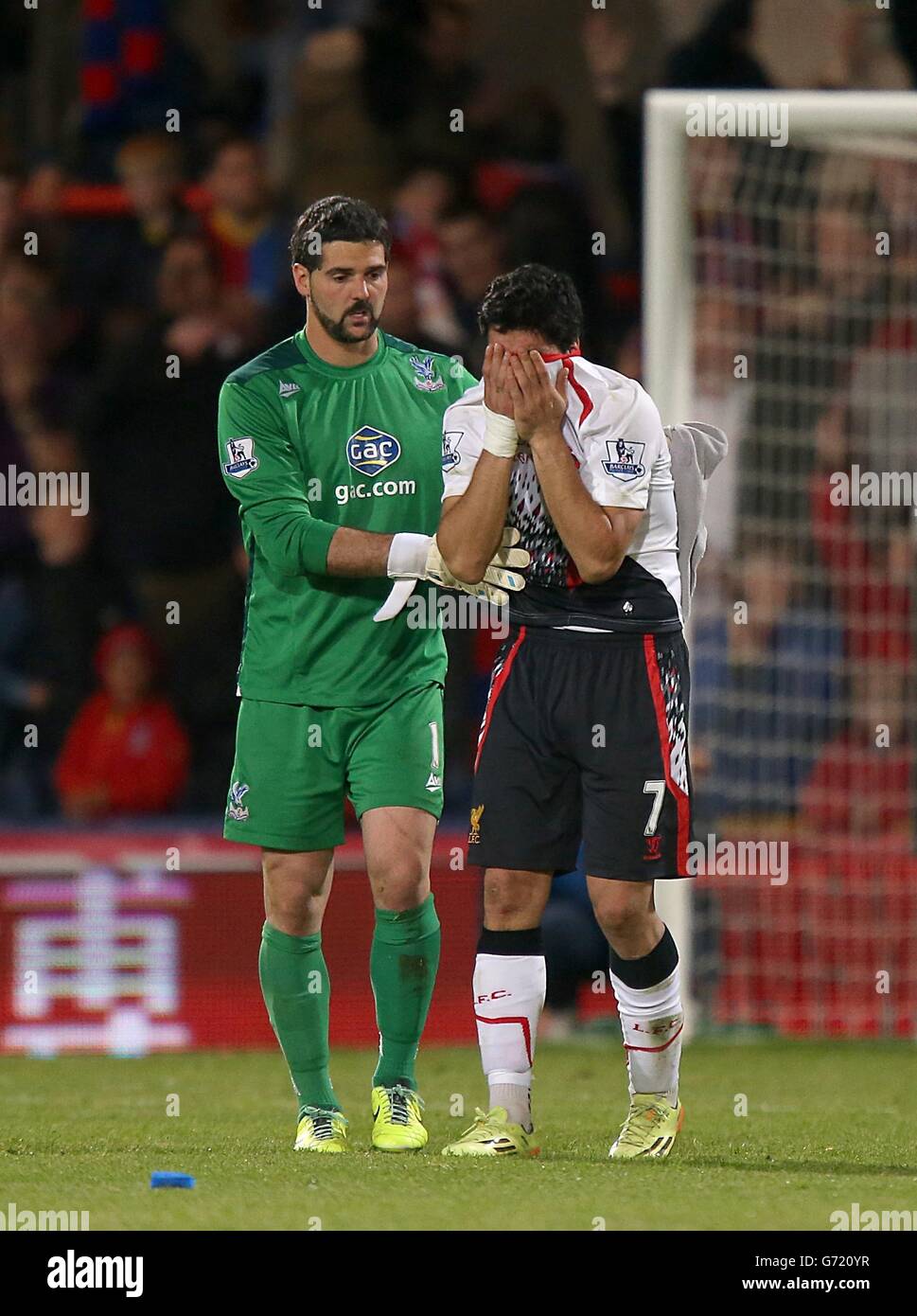 Liverpool's Luis Suarez is consoled by Crystal Palace goalkeeper Julian ...