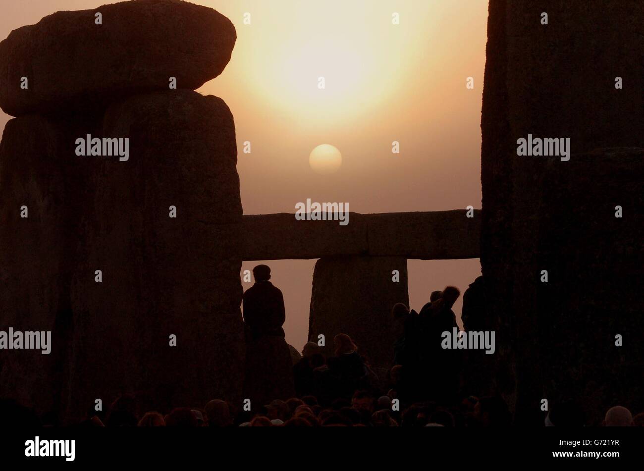 The sun rises over Stonhenge in Wiltshire at dawn where more than ...