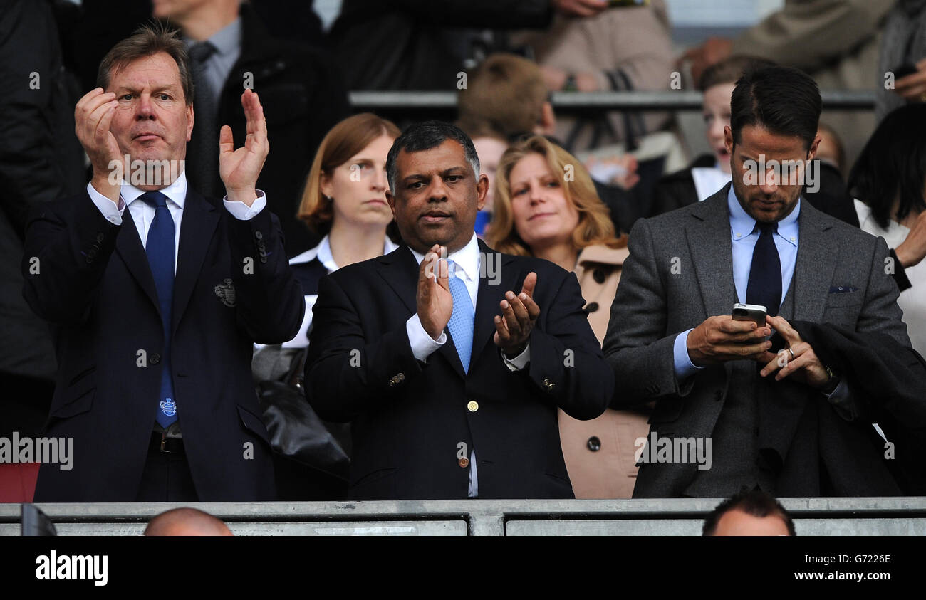 Queens Park Rangers owner Tony Fernandez (centre) applauds his team ...
