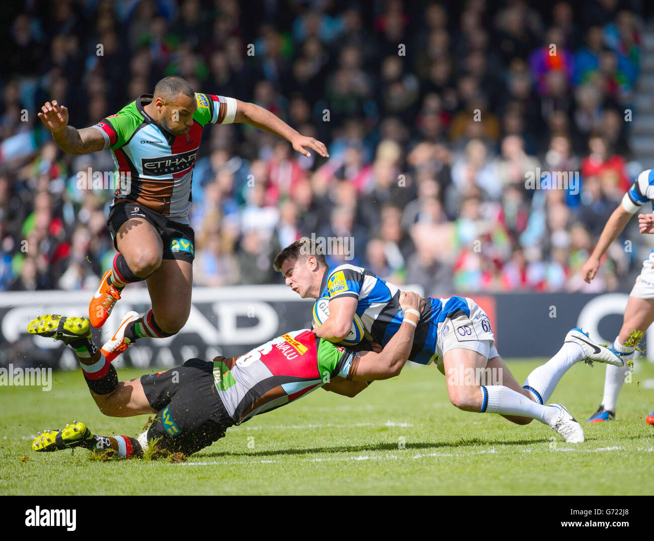 Bath Rugby's Ollie Devoto (right) is tackled by Harlequins' Maurie Fa ...