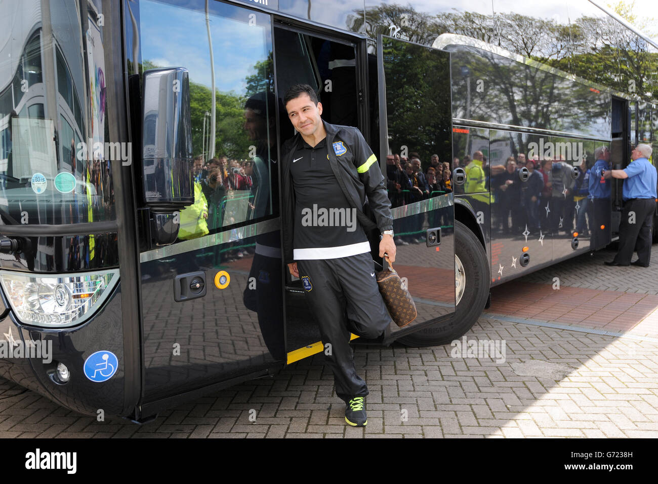 Everton's Antolin Alcaraz alights from the team bus as they arrive at ...