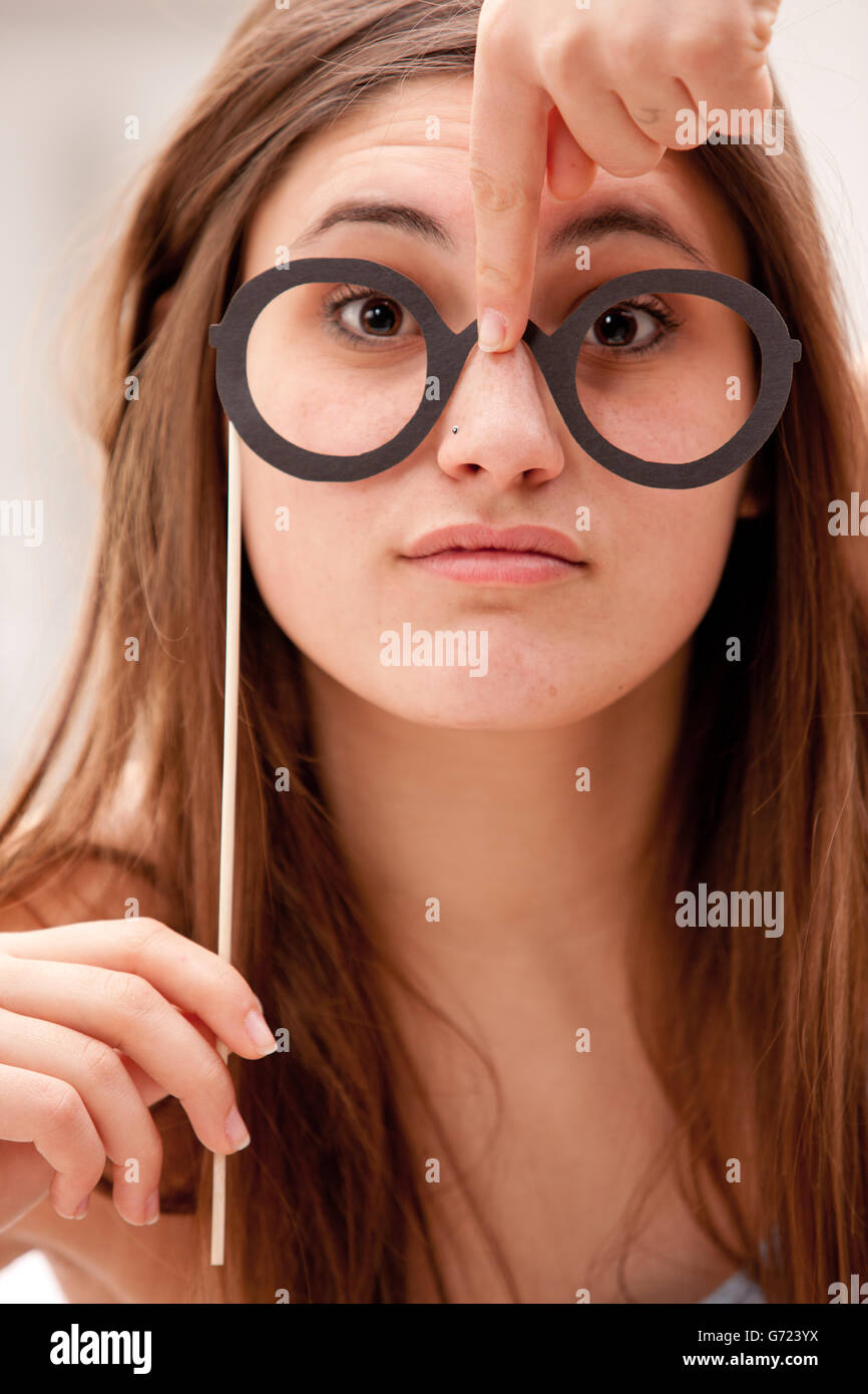 this girl jokes with black fake carton glasses Stock Photo - Alamy