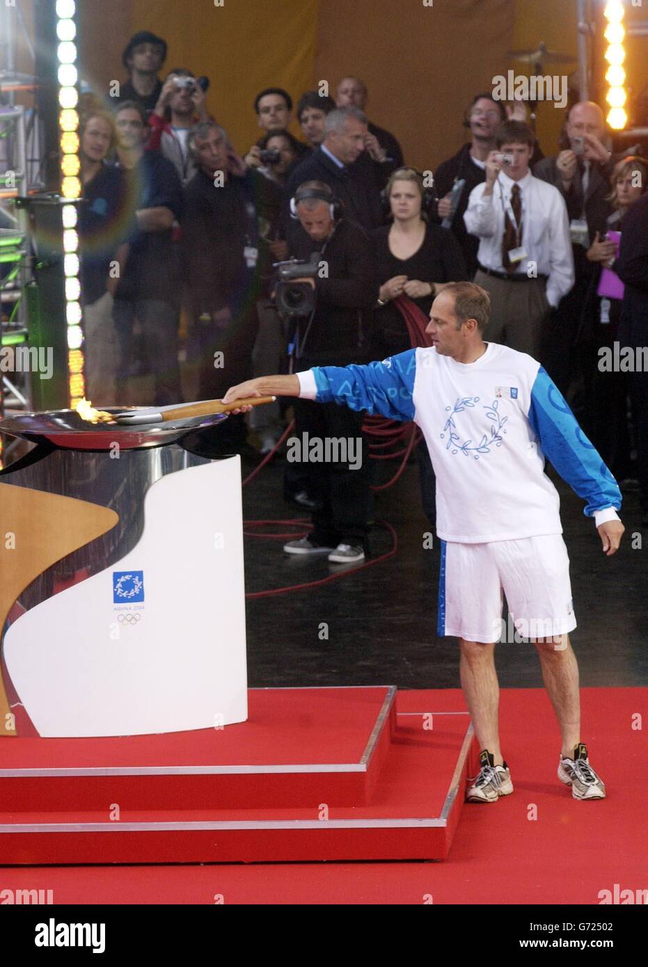 Olympic gold medallist Sir Steven Redgrave lights the Oylmpic cauldron ...
