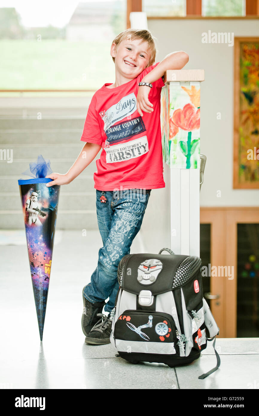 Boy starting school, with First-Day-of School-cone Stock Photo - Alamy