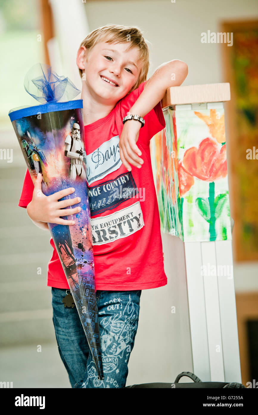 Boy starting school, with First-Day-of School-cone Stock Photo - Alamy