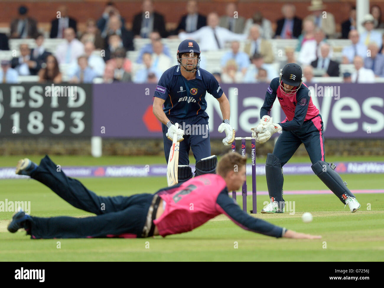 Essex's Alastair Cook hits a shot past Middlesex's Ollie Rayner during ...