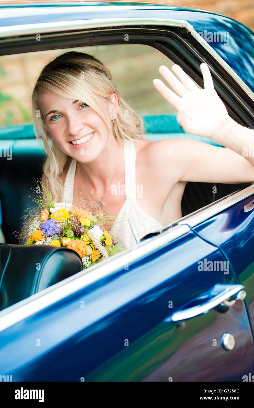 Bride in wedding car Stock Photo - Alamy
