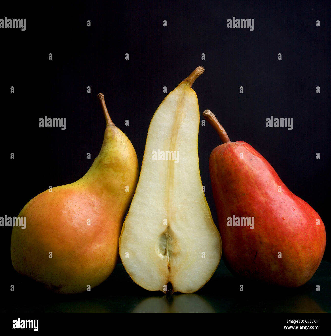 Whole and halved pear fruit still life hi-res stock photography and ...