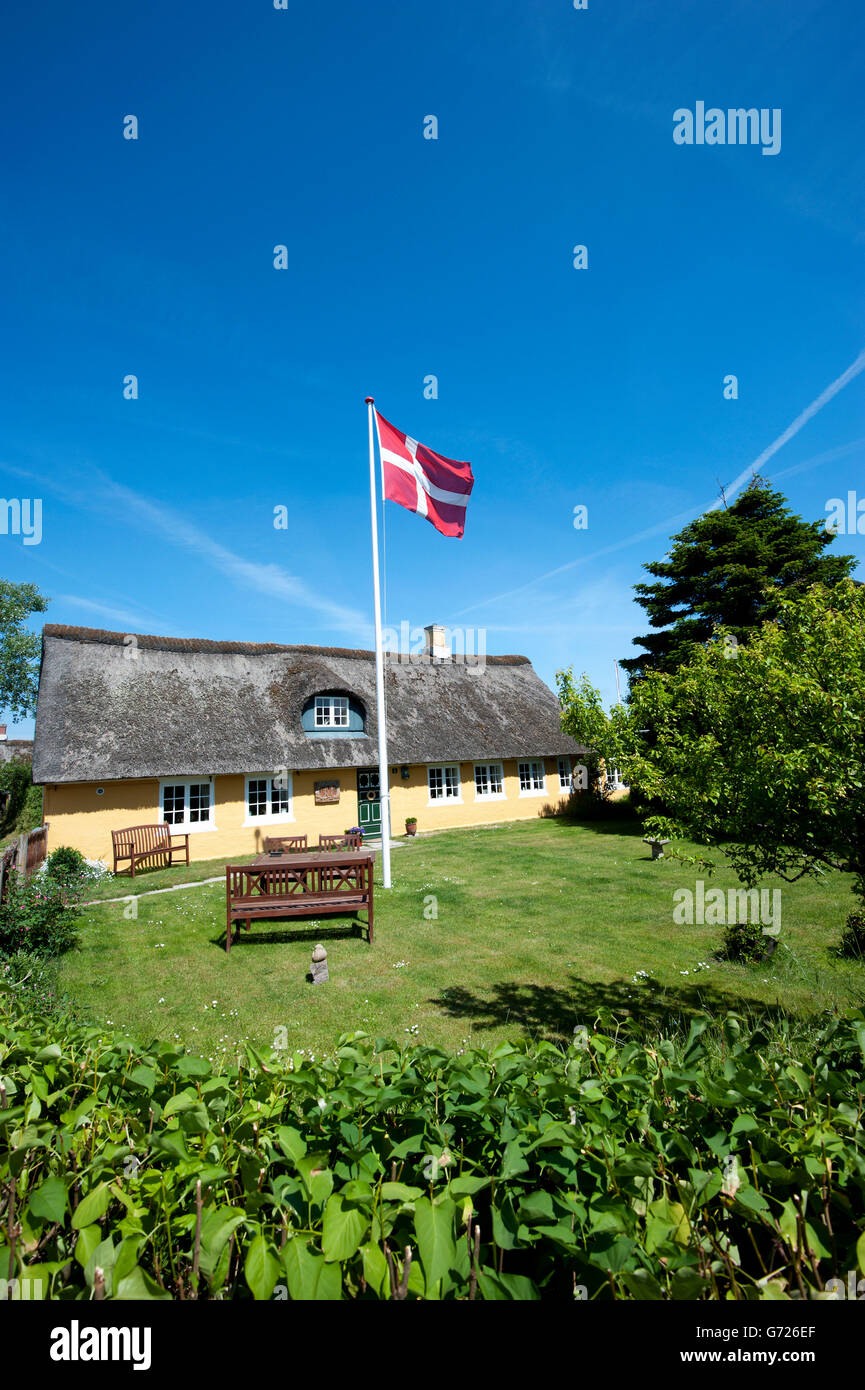House and Danish flag in Sonderho, Fano island, Denmark, Scandinavia ...