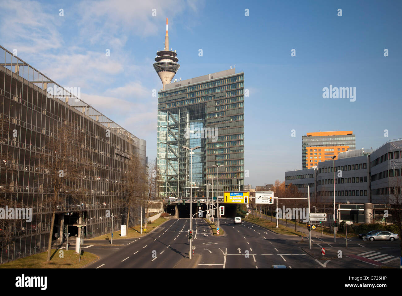 Voelklinger Strasse road with Stadttor building and Rheinturm tower ...