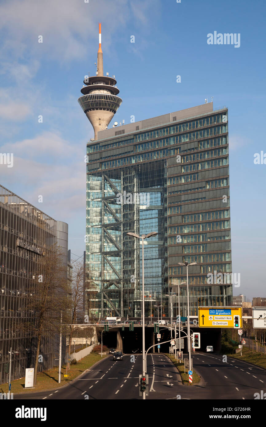 Voelklinger Strasse road with Stadttor building and Rheinturm tower ...
