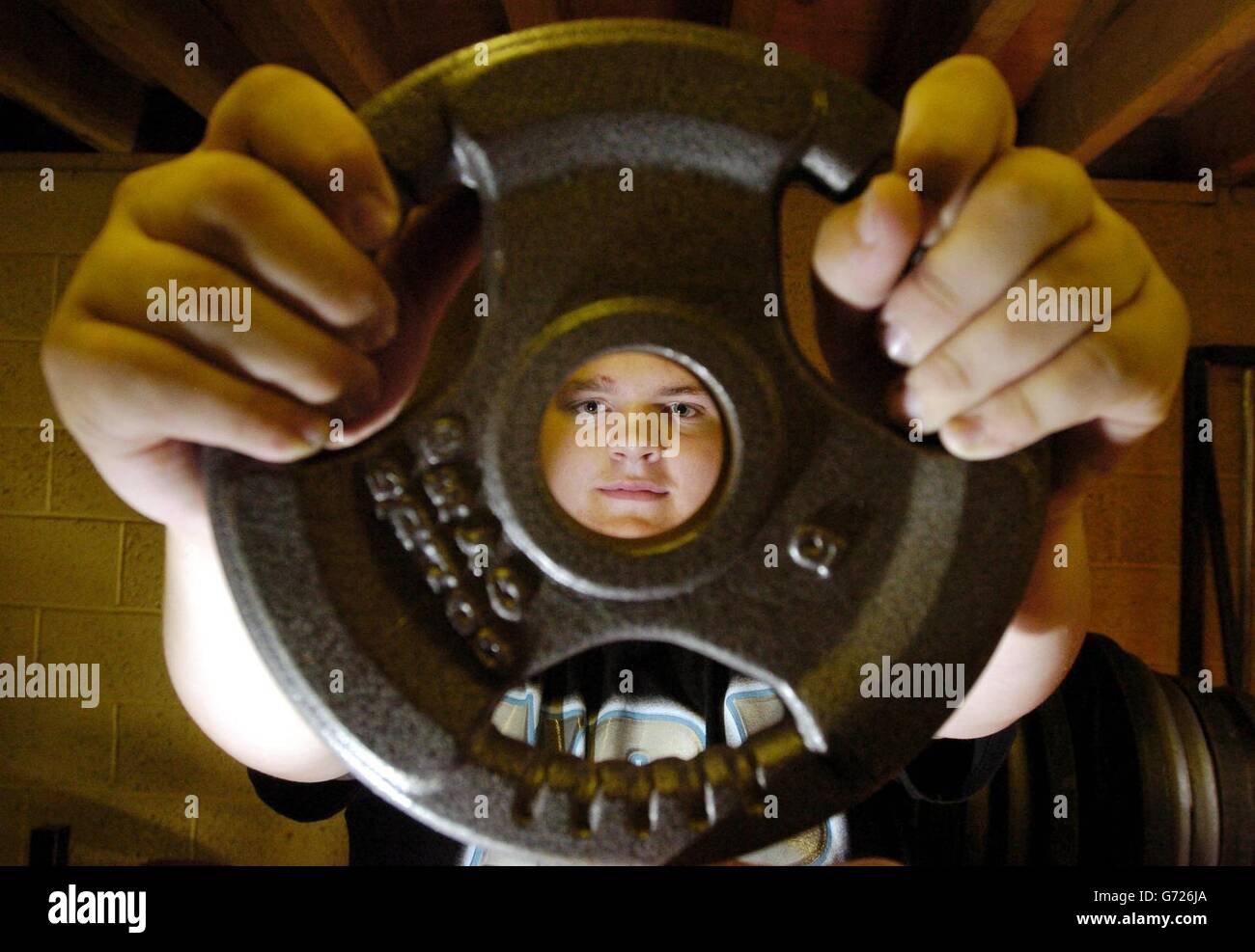 Boy bodybuilder Kevin Fortune, aged 12, in his neighbour's gym ...