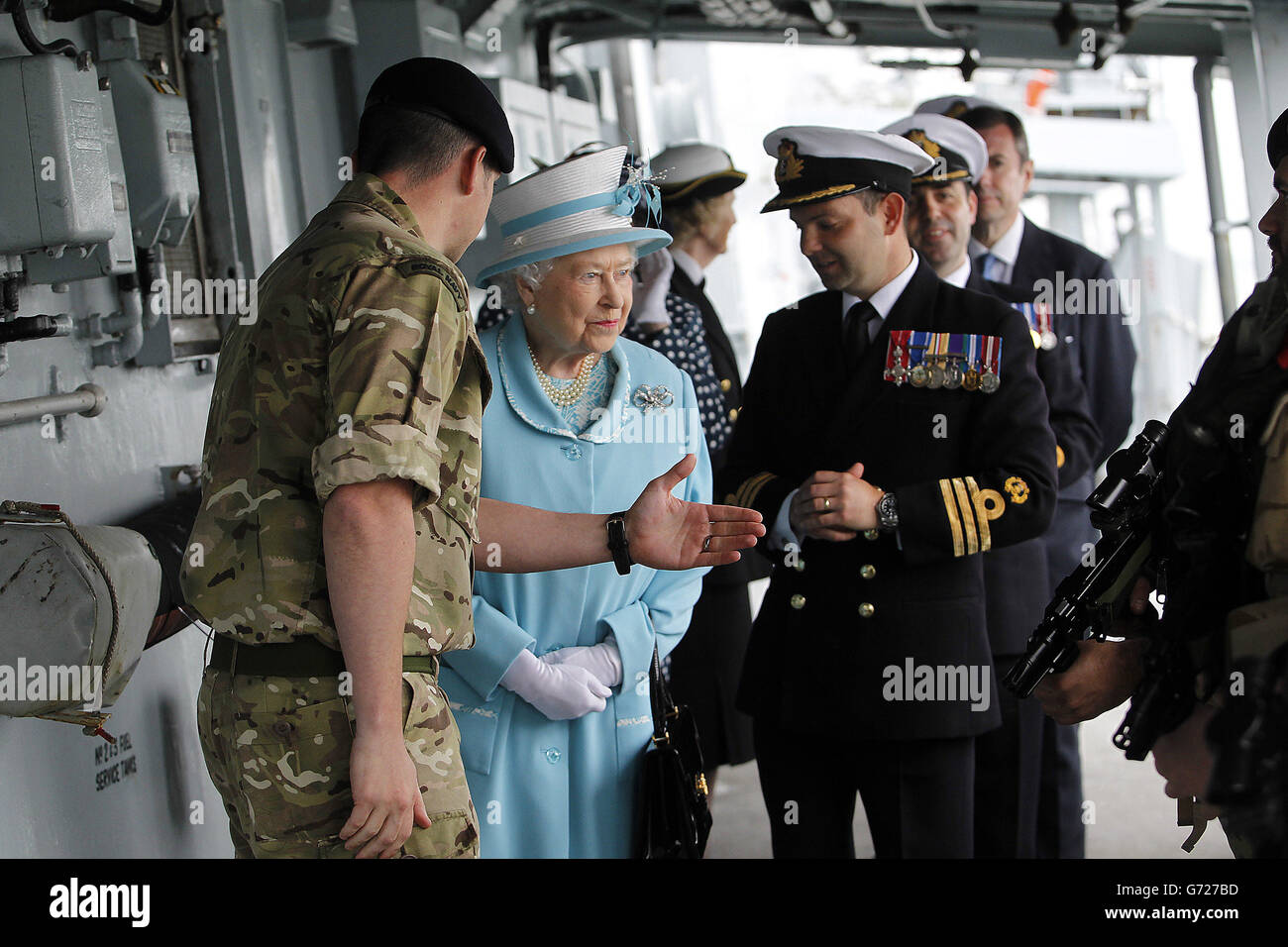 Queen Elizabeth II meets members of a boarding team who were involved ...