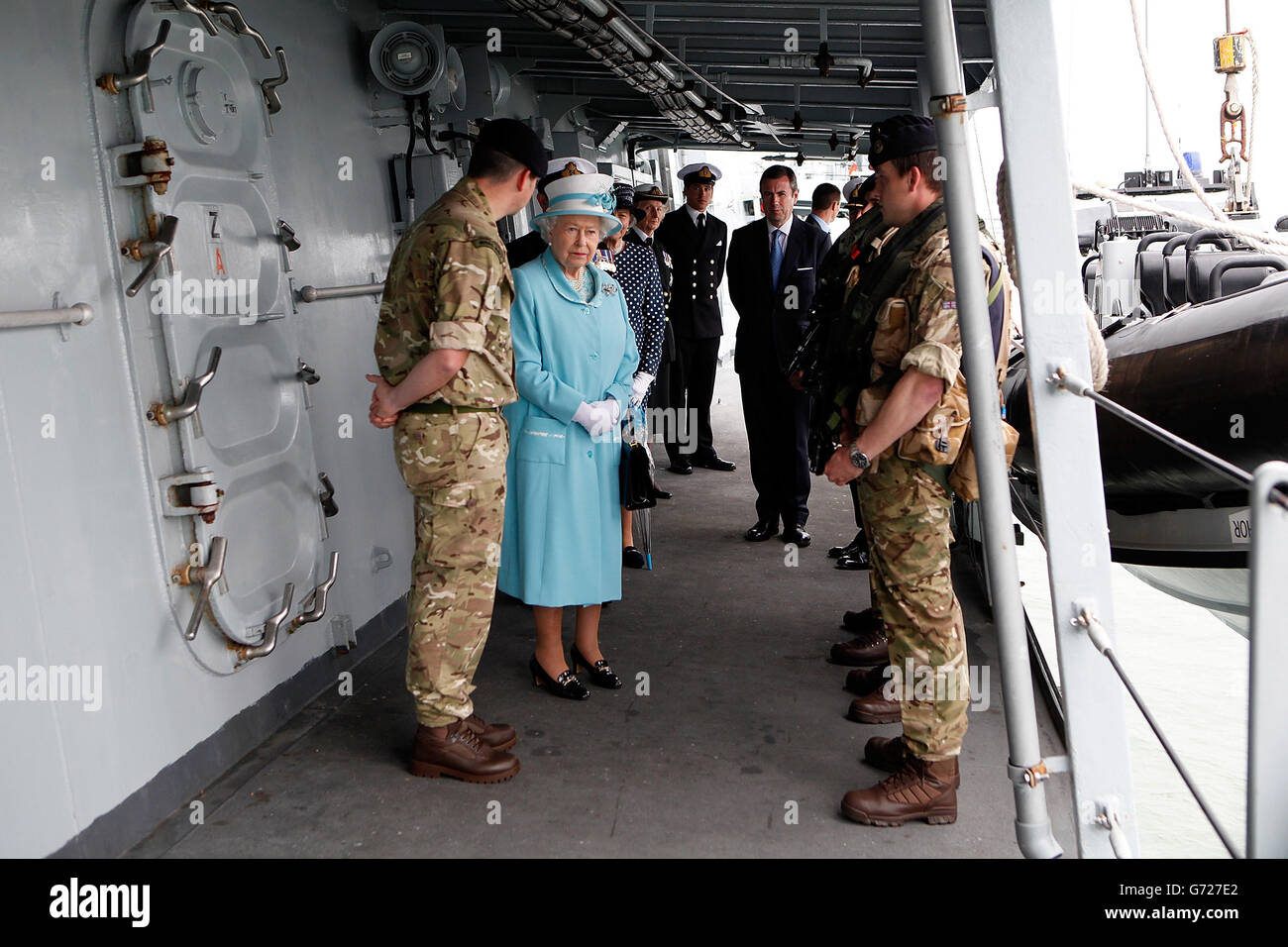 Queen Elizabeth II meets members of a boarding team who were involved ...