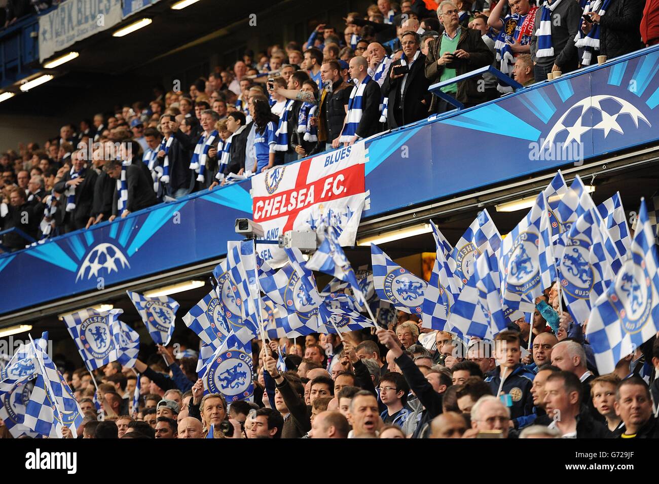 General view of Chelsea fans showing support for their team with flags ...