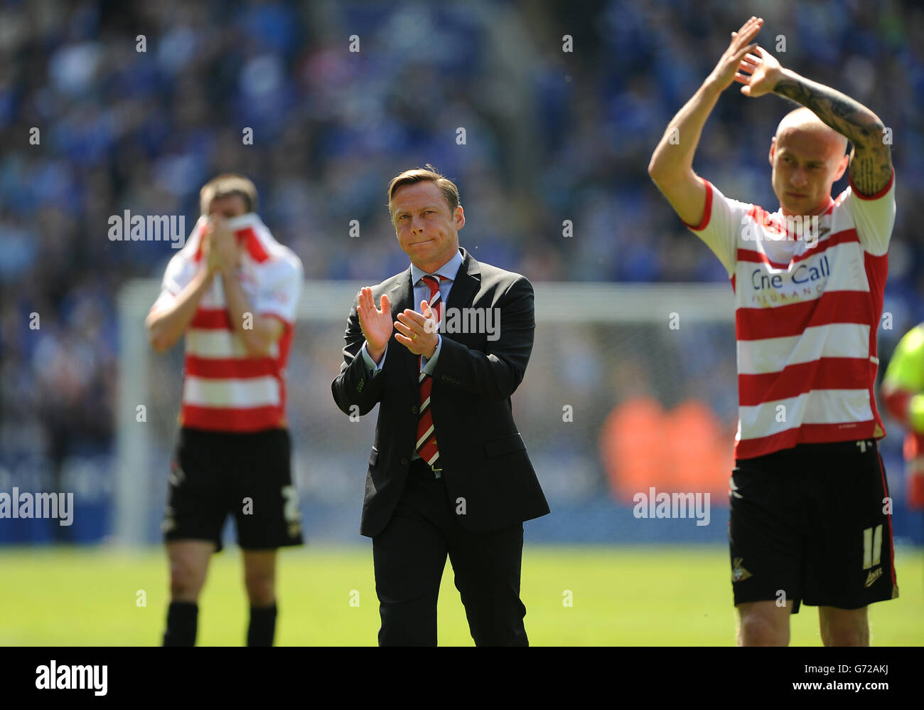 Doncaster Rover's Manager Paul Dickov (centre) and David Cotterill ...