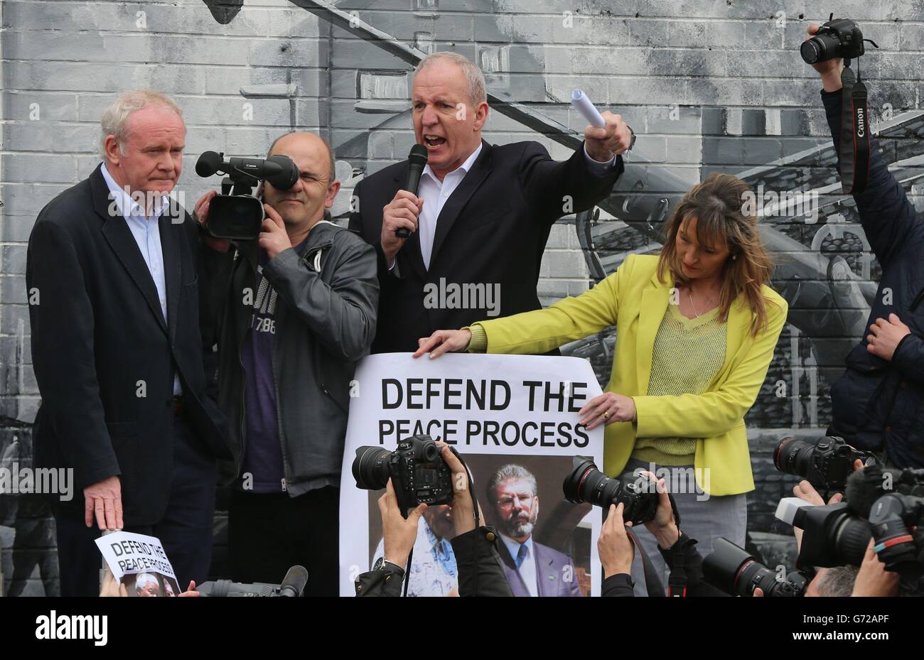 Sinn Fein's Martin McGuinness (left) and Bobby Storey (3rd left ...