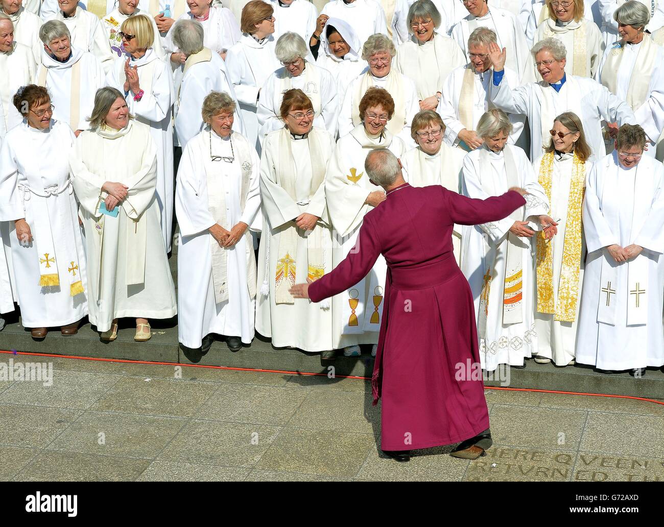 The Archbishop of Canterbury Justin Welby (in purple) joins women ...