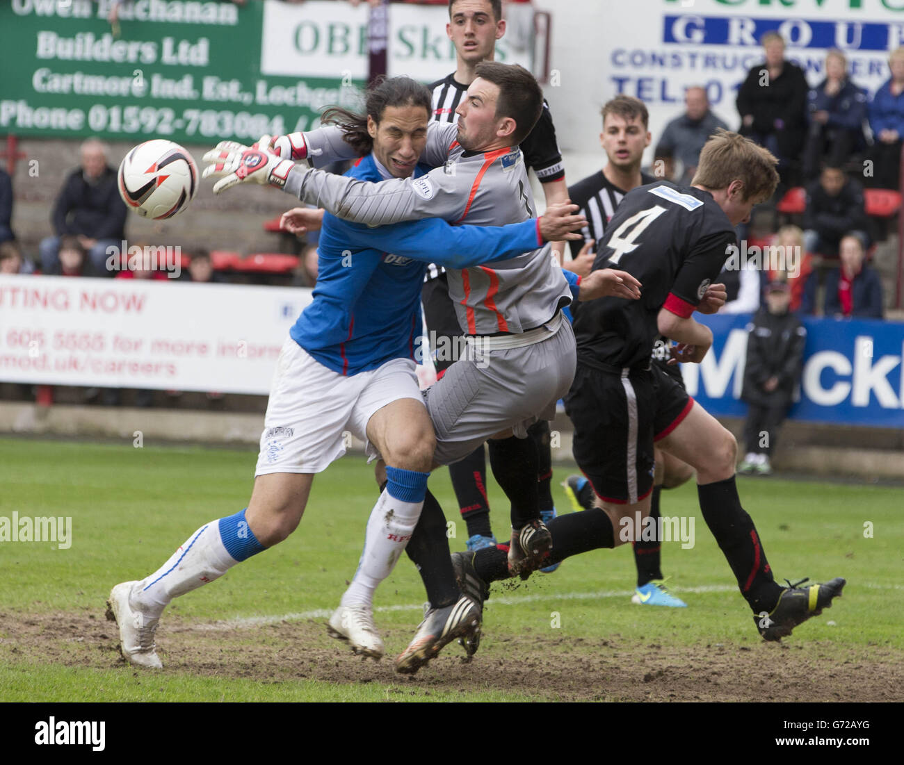 Rangers Bilel Mohsni clashes with Dunfermline keeper Ryan Goodfellow ...