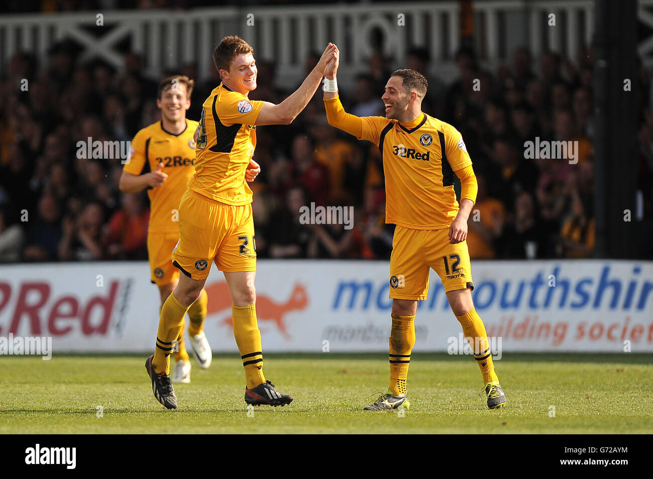 Newport County's Kevin Feely (left) celebrates with team mate Robbie ...